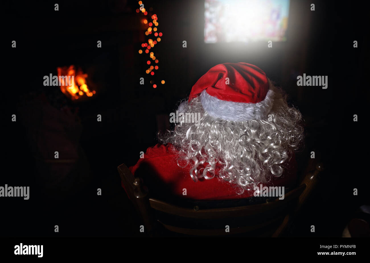 Santa watching tv hi-res stock photography and images - Alamy