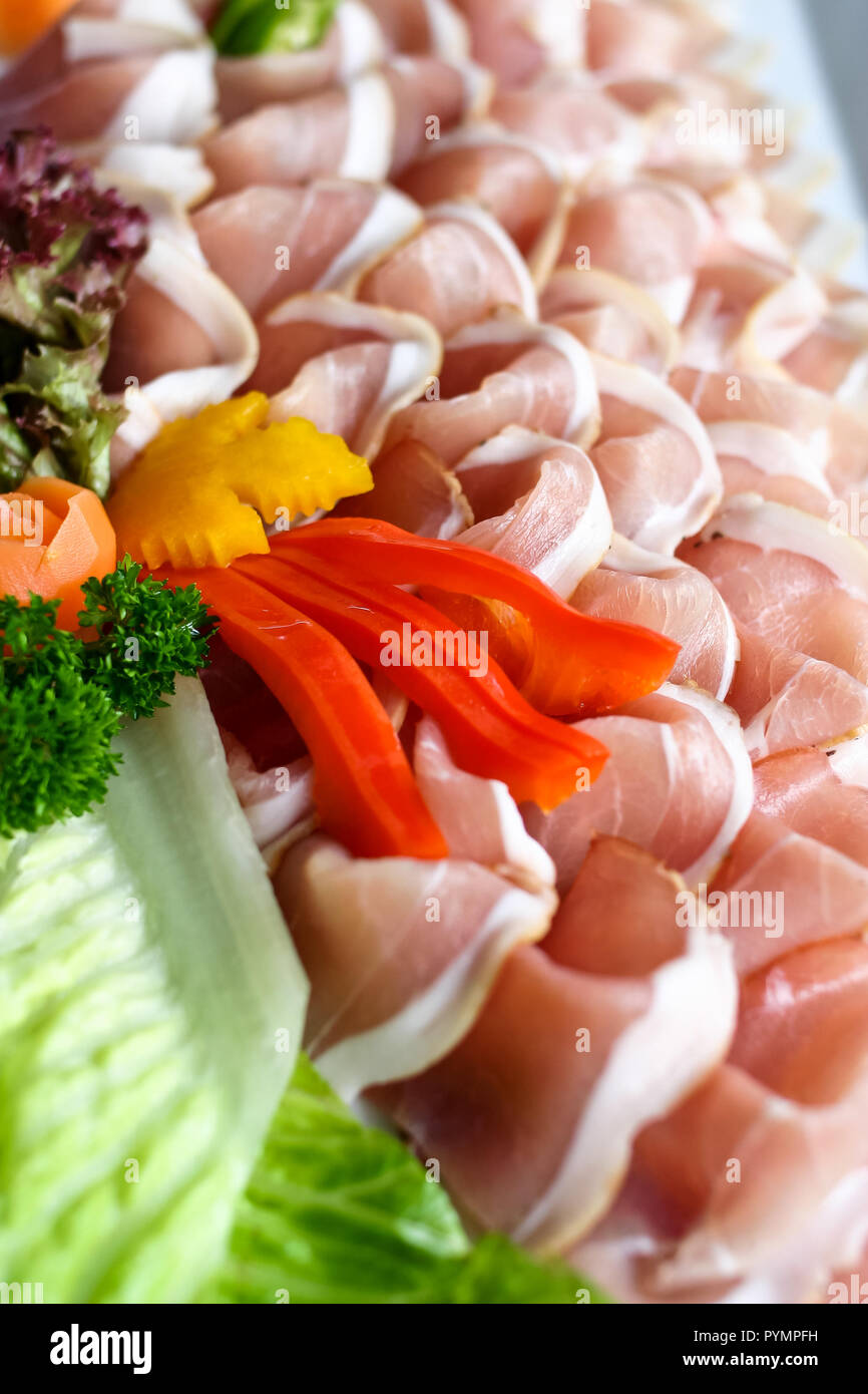 Parma ham platter with garnish Stock Photo - Alamy
