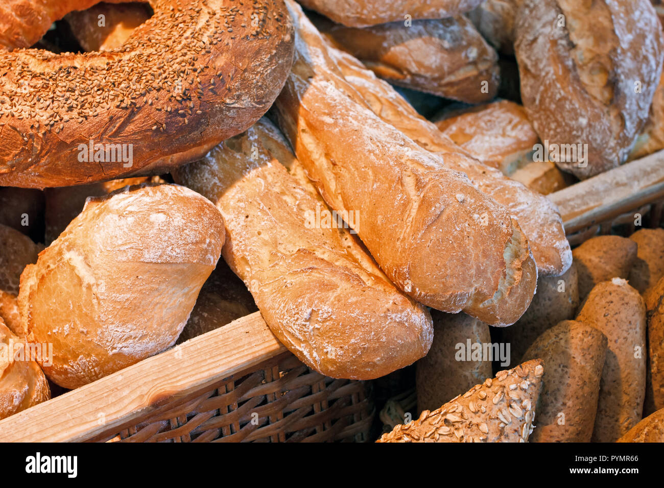 Rustic bread selection in a basket Stock Photo - Alamy