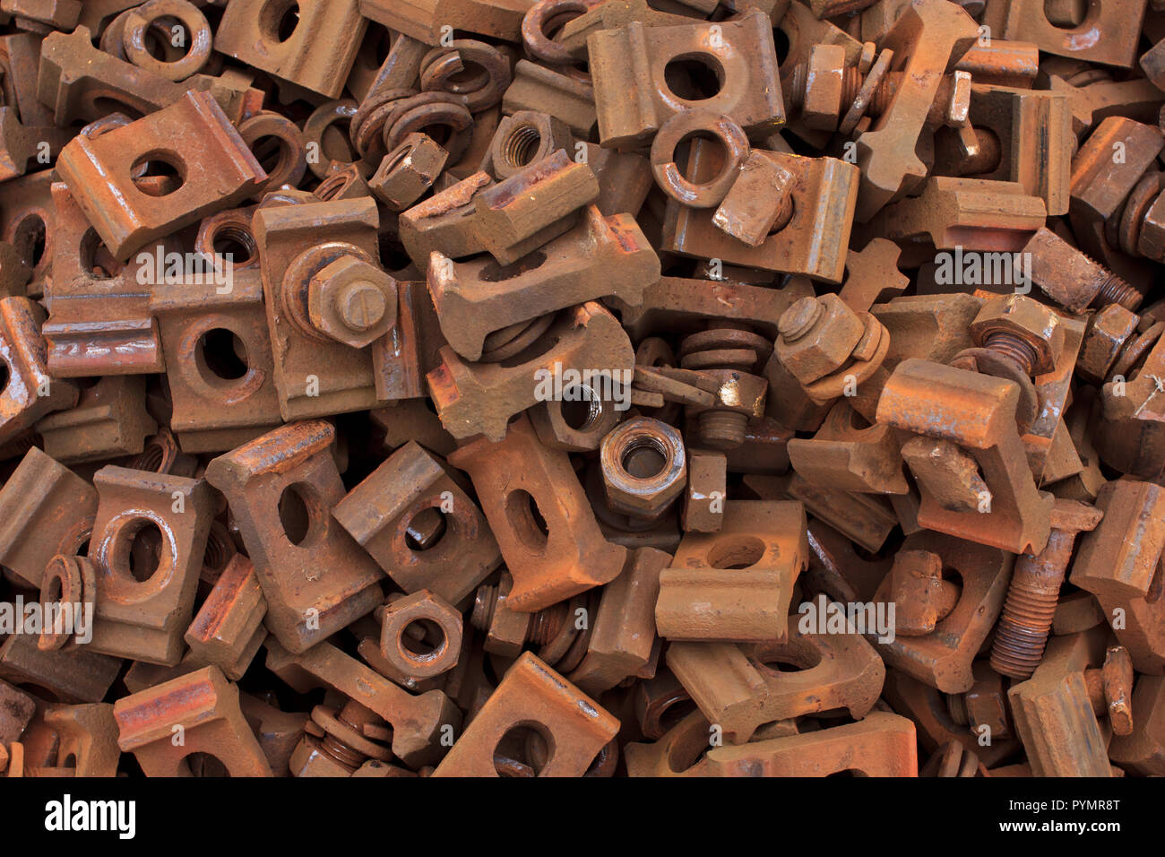 Rusty train track nuts, bolts, washers and clasps Stock Photo - Alamy
