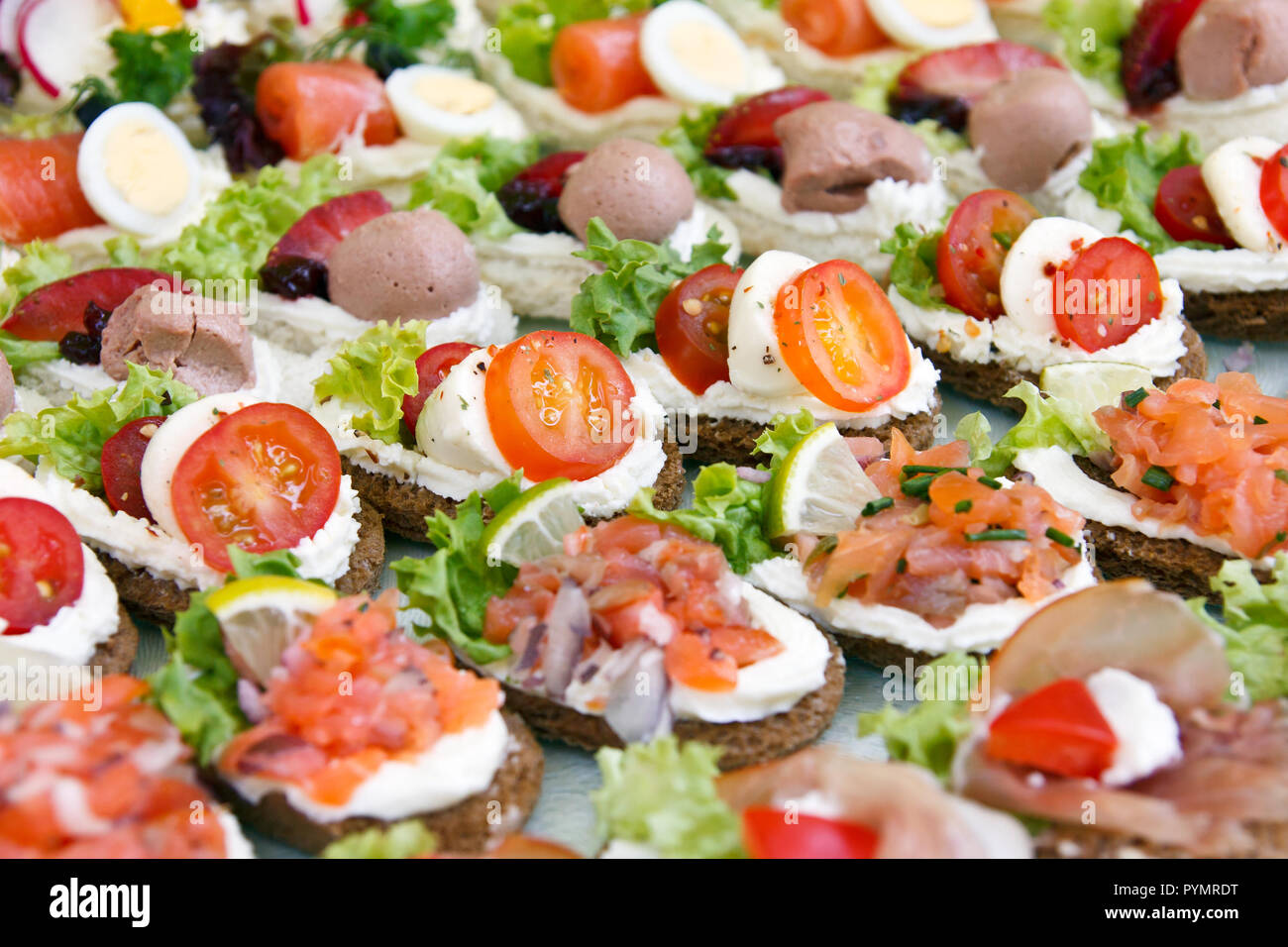 Mixed mini canapes on a plate Stock Photo - Alamy