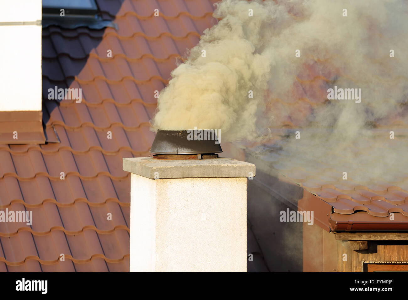 Smoke raising from of a house chimney air pollution and empty space for ...