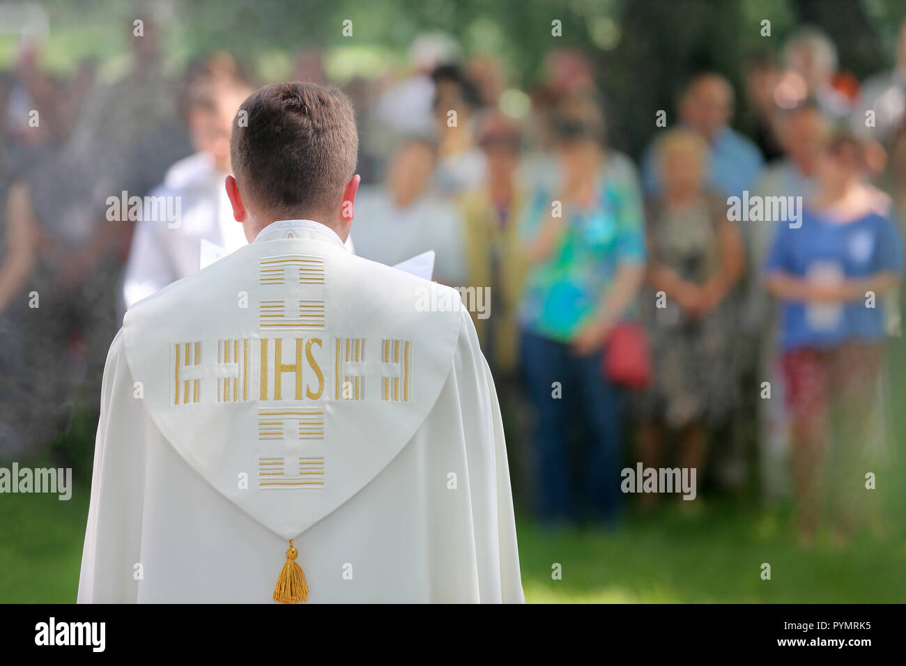 Priest celebrate mass outdoors and empty place for text Stock Photo - Alamy
