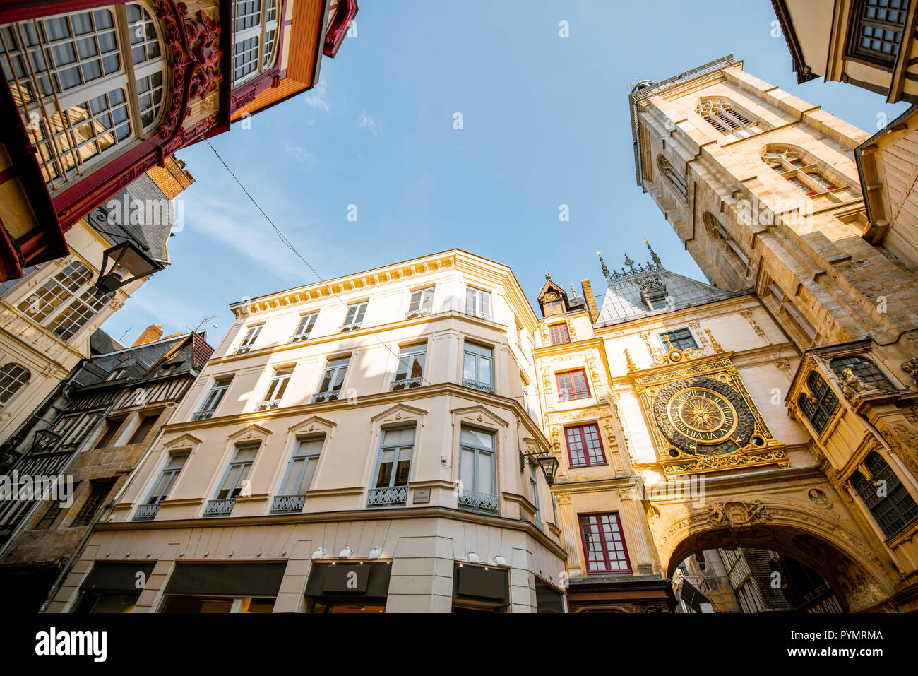 Street view with ancient buildings and Great clock on renaissance arch ...