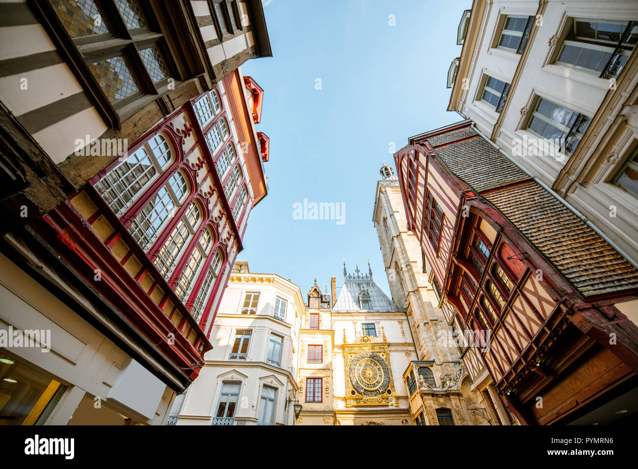 Street view with ancient buildings and Great clock on renaissance arch ...