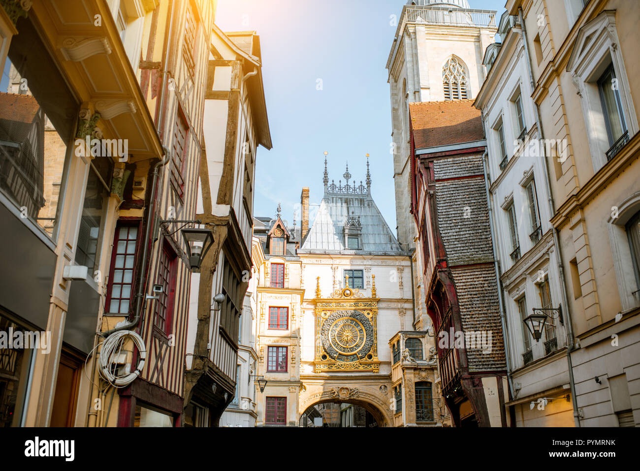 Street view with ancient buildings and Great clock on renaissance arch ...