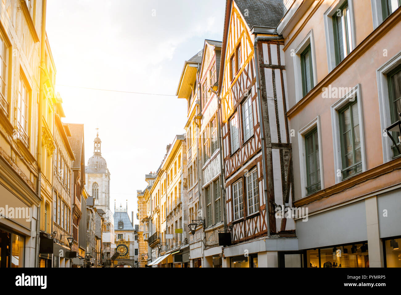 Street view with ancient buildings and Great clock on renaissance arch ...