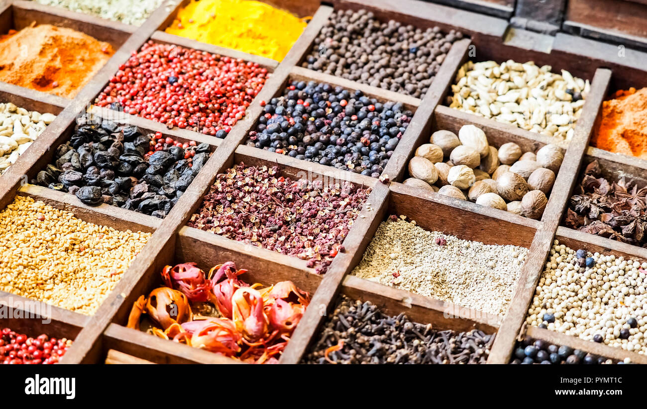 Collection multicolored mosaic spices assortment in wooden box ...