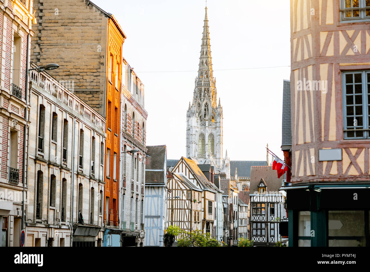 Street view with beautiful old buildings and cathedral tower on the ...