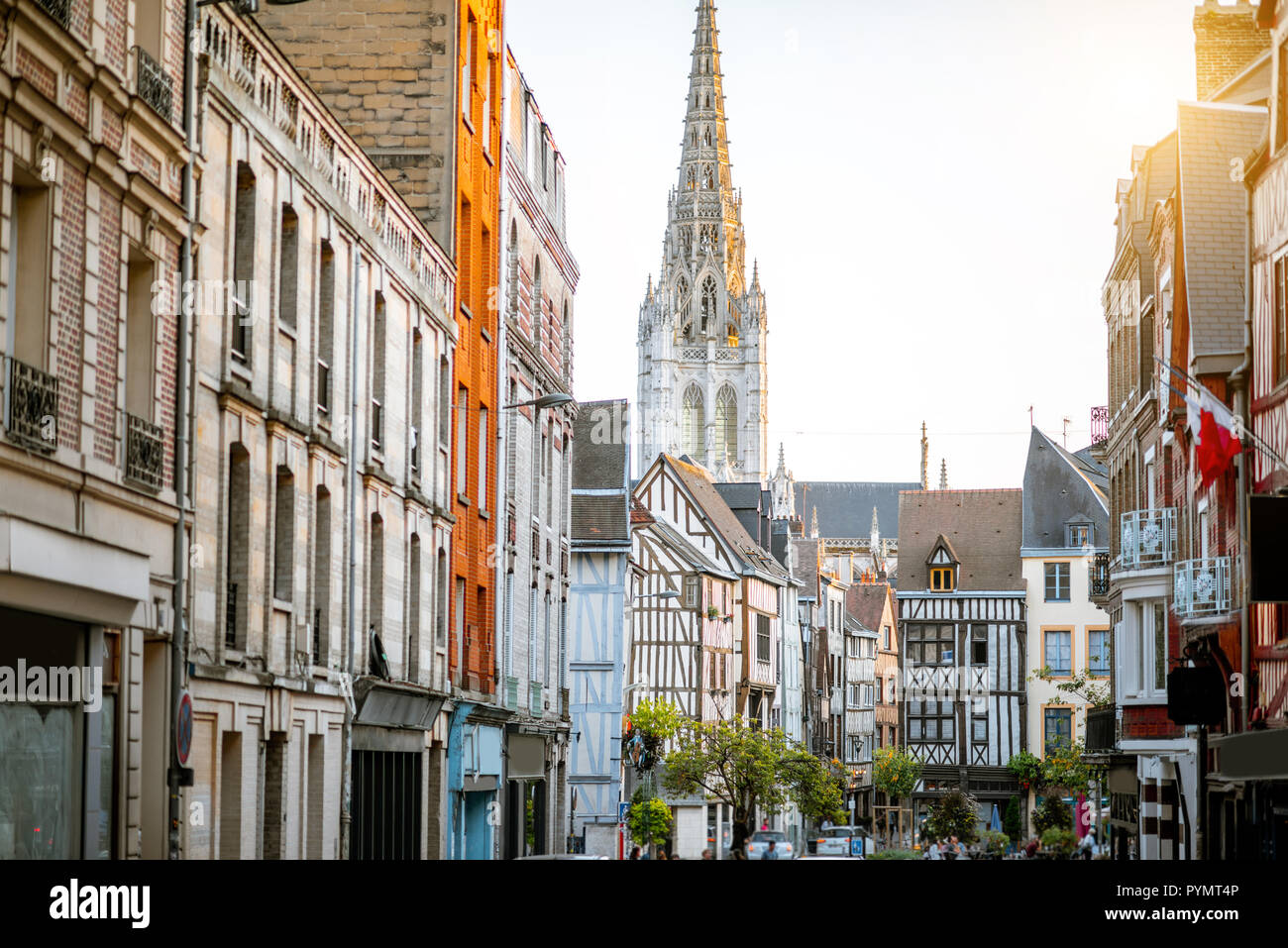 Street view with beautiful old buildings and cathedral tower on the ...