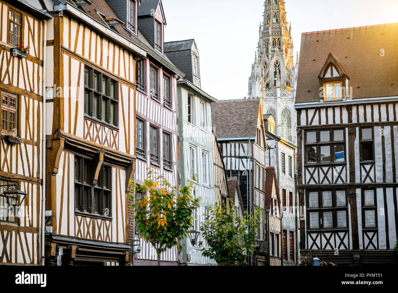 Street view with beautiful old buildings and cathedral tower on the ...