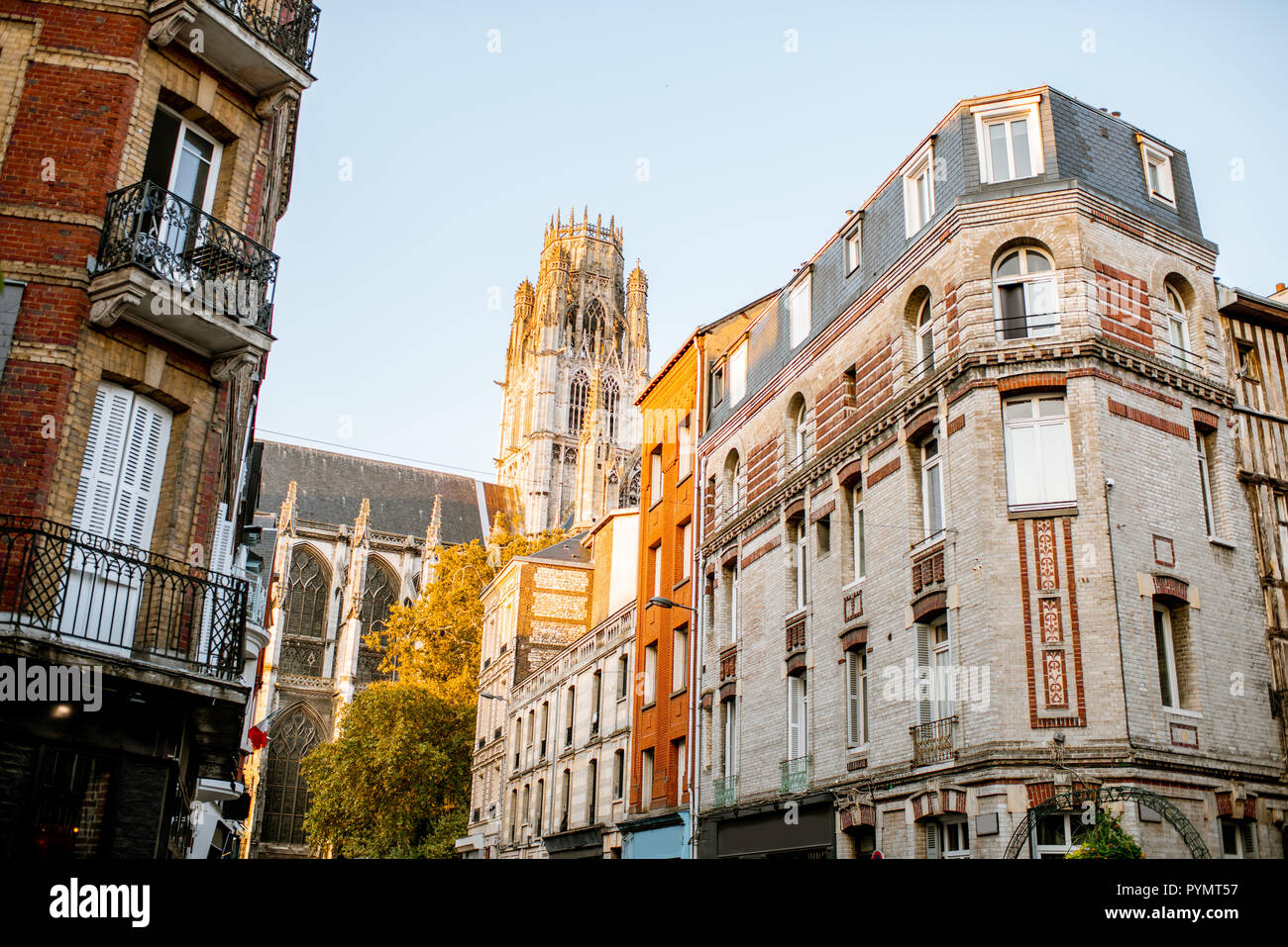 Street view with beautiful old buildings and cathedral tower on the ...
