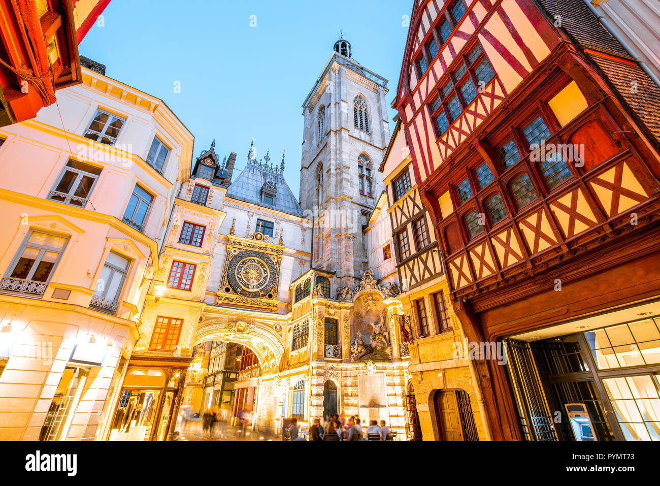 Street view with illuminated buildings and famous clock tower during ...