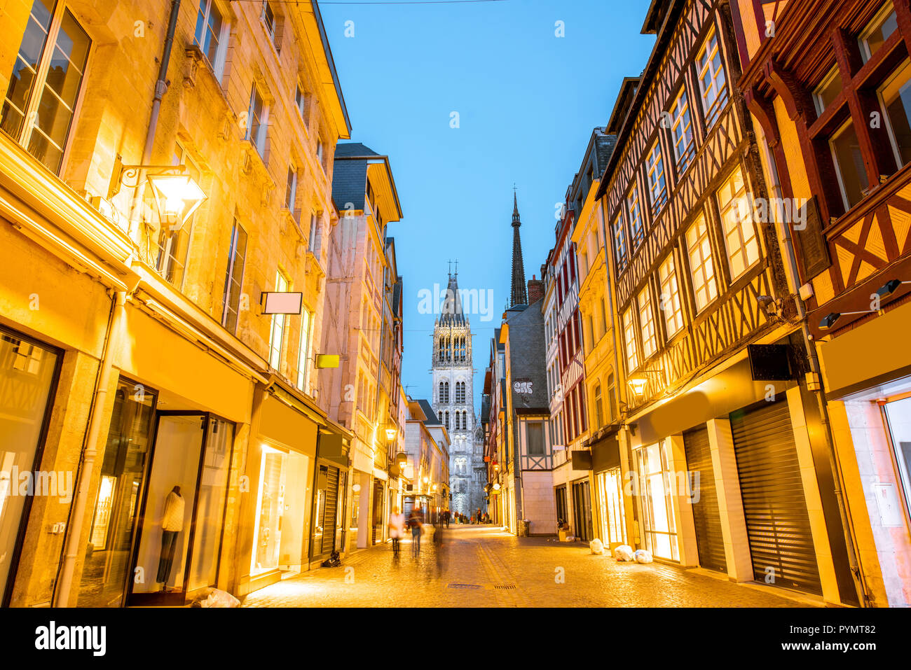 Street view with illuminated buildings and famous cathedral during the ...