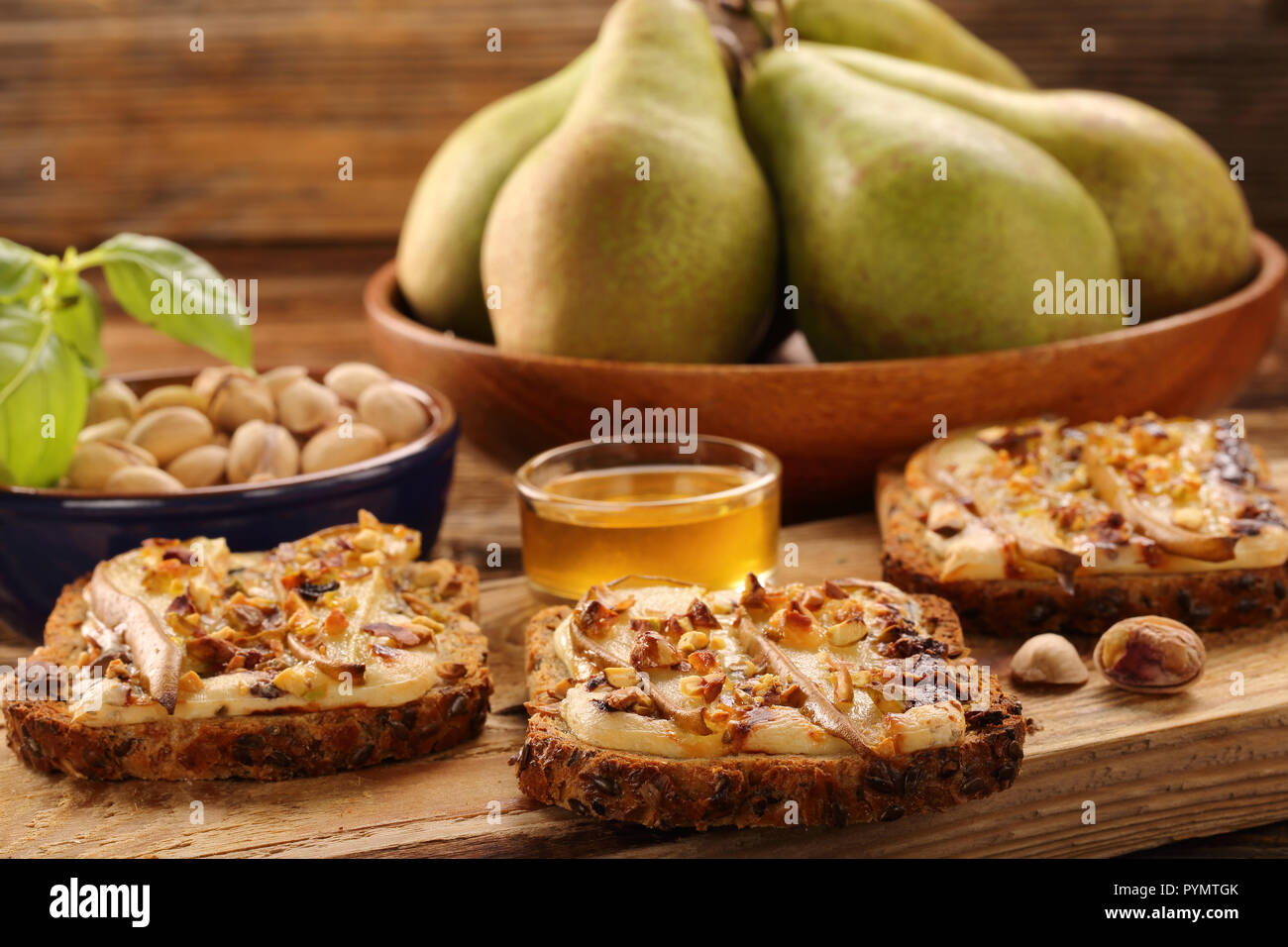 Grilled blue cheese sandwich with pears pistachios and honey Stock ...