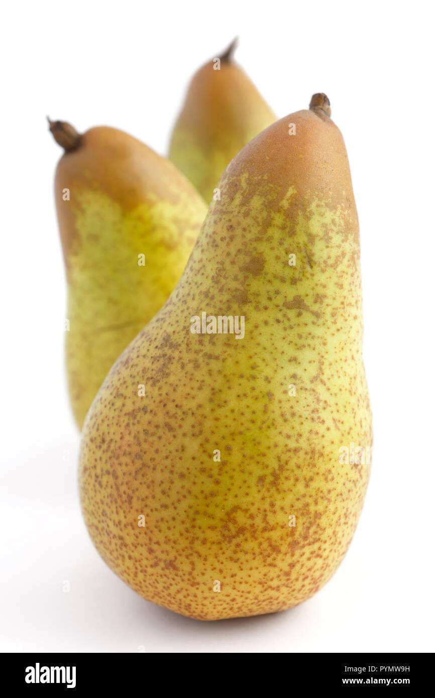 Three standing whole pears isolated on white Stock Photo - Alamy