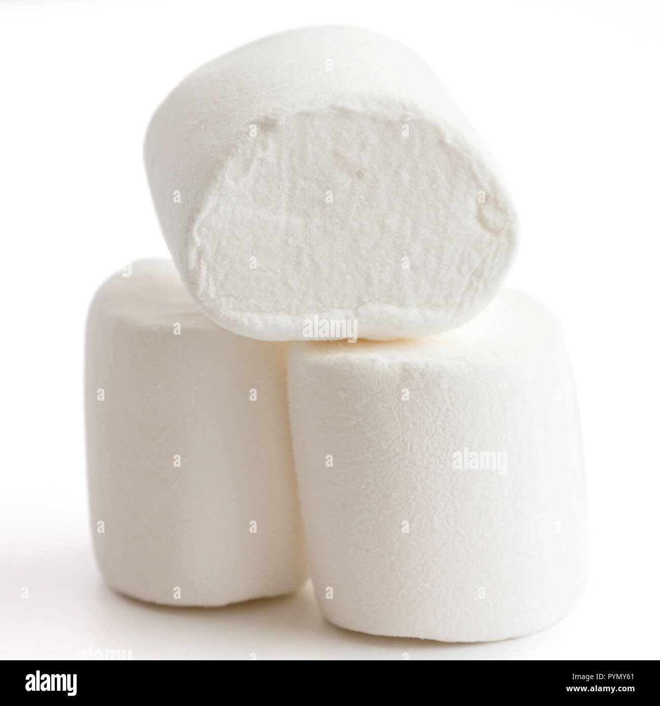 Three marshmallows stacked and isolated on white Stock Photo - Alamy
