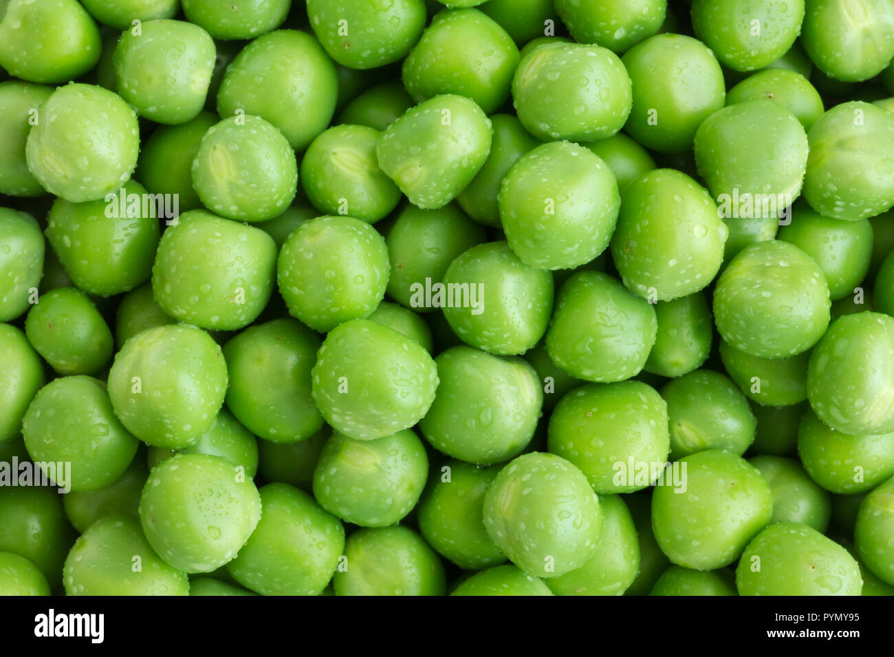 Fresh garden peas shot from above. Wet Stock Photo - Alamy