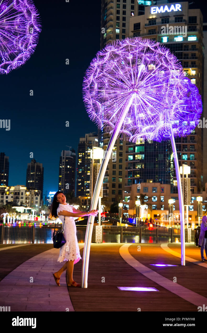 Dubai, United Arab Emirates - May 18, 2018: Girl enjoying night time ...