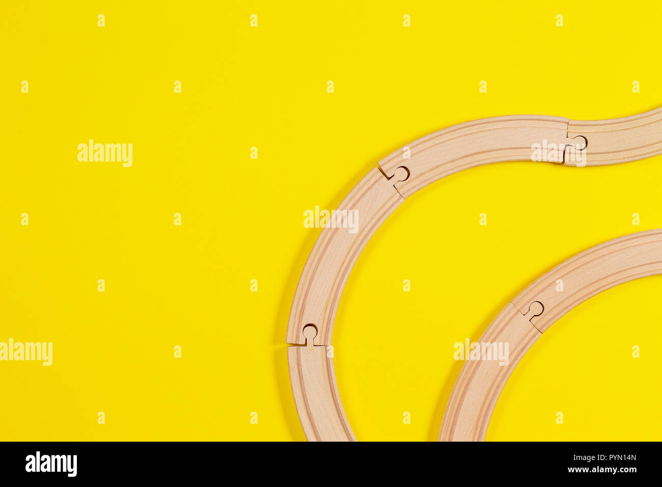 Wooden rails on yellow background. Top view Stock Photo - Alamy