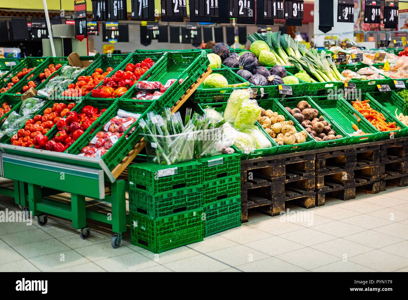 Fresh raw vegetables on the display in supermarket Stock Photo - Alamy
