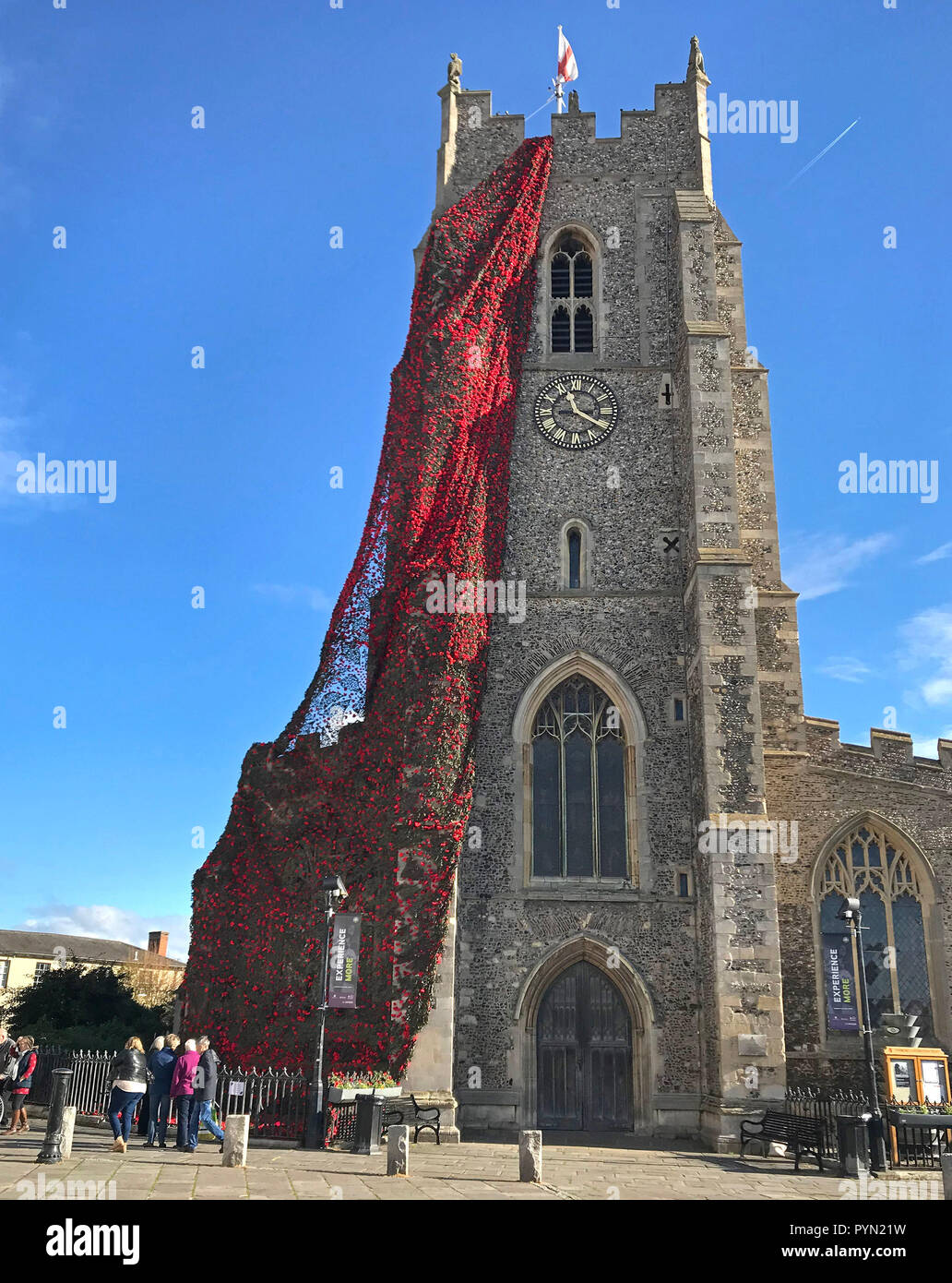 A cascade of knitted and crocheted poppies hanging from St Peter's ...