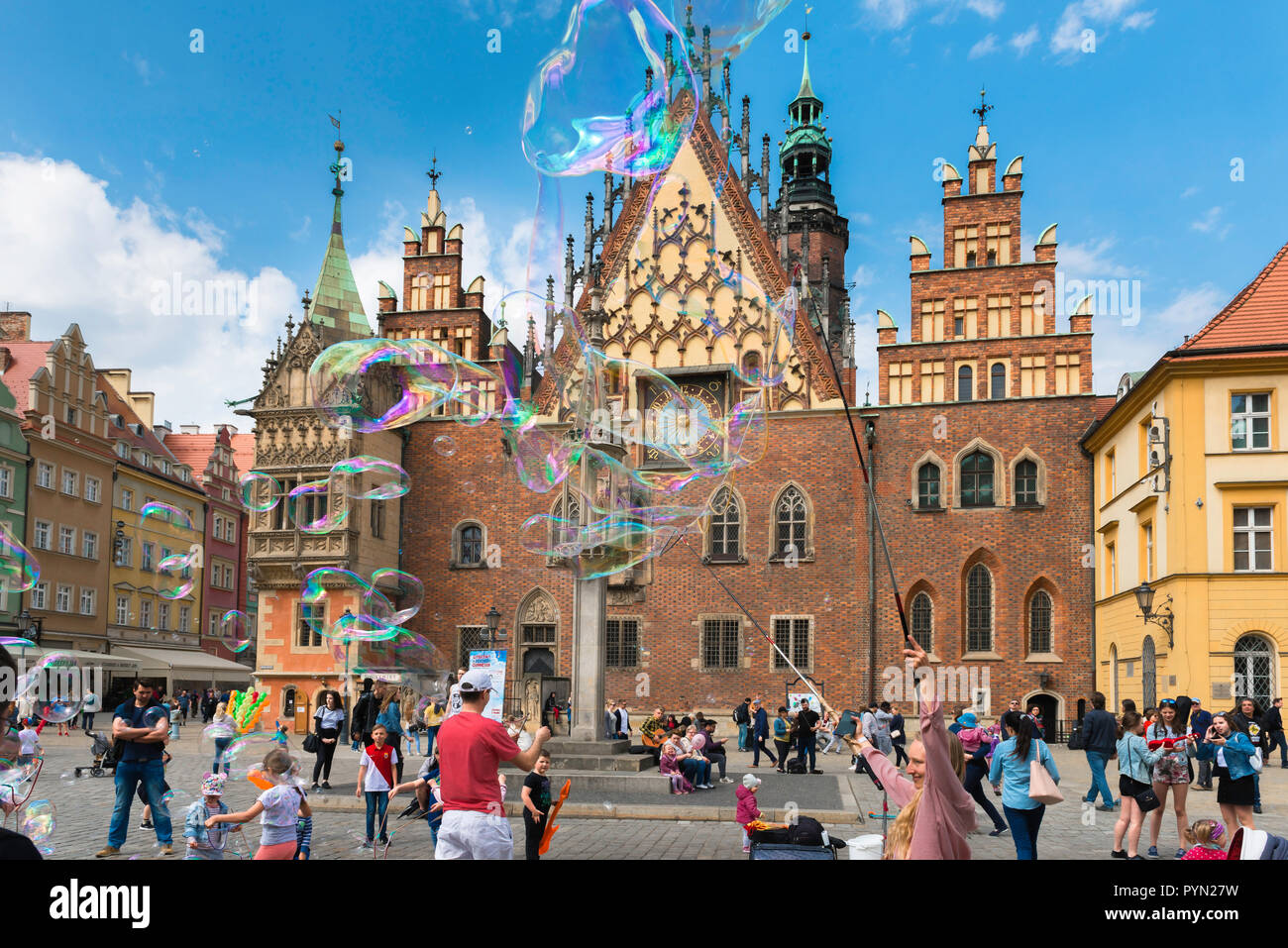 Wroclaw city square, in summer a street entertainer in the medieval ...