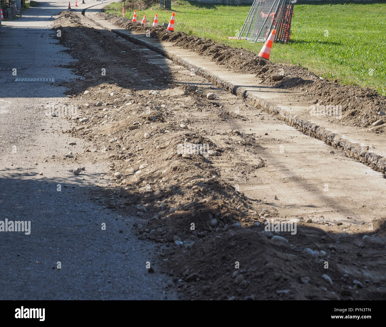 road excavation works at construction site for laying of fibre optic ...