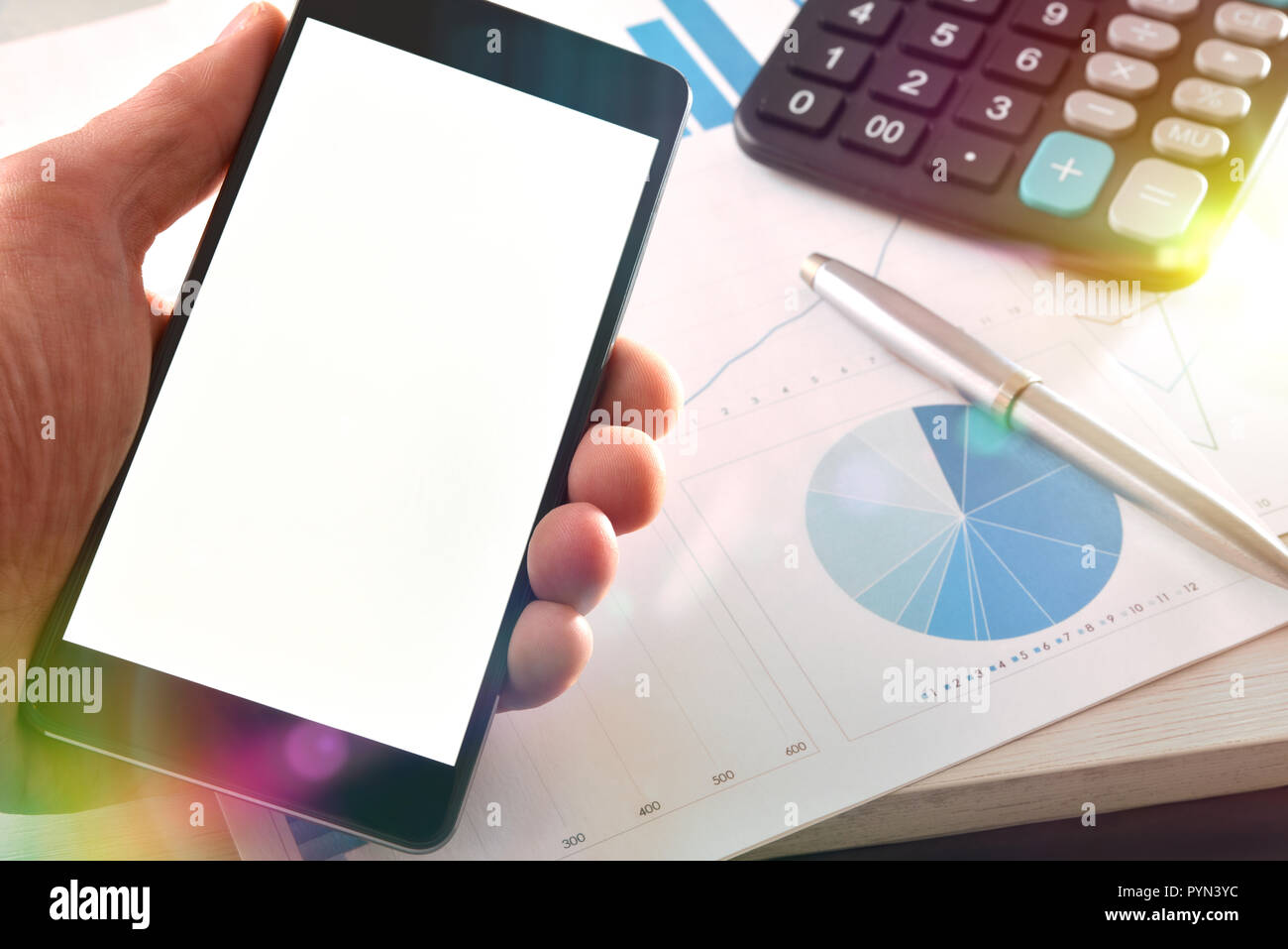 Businessman working and consulting a mobile in an office close up ...