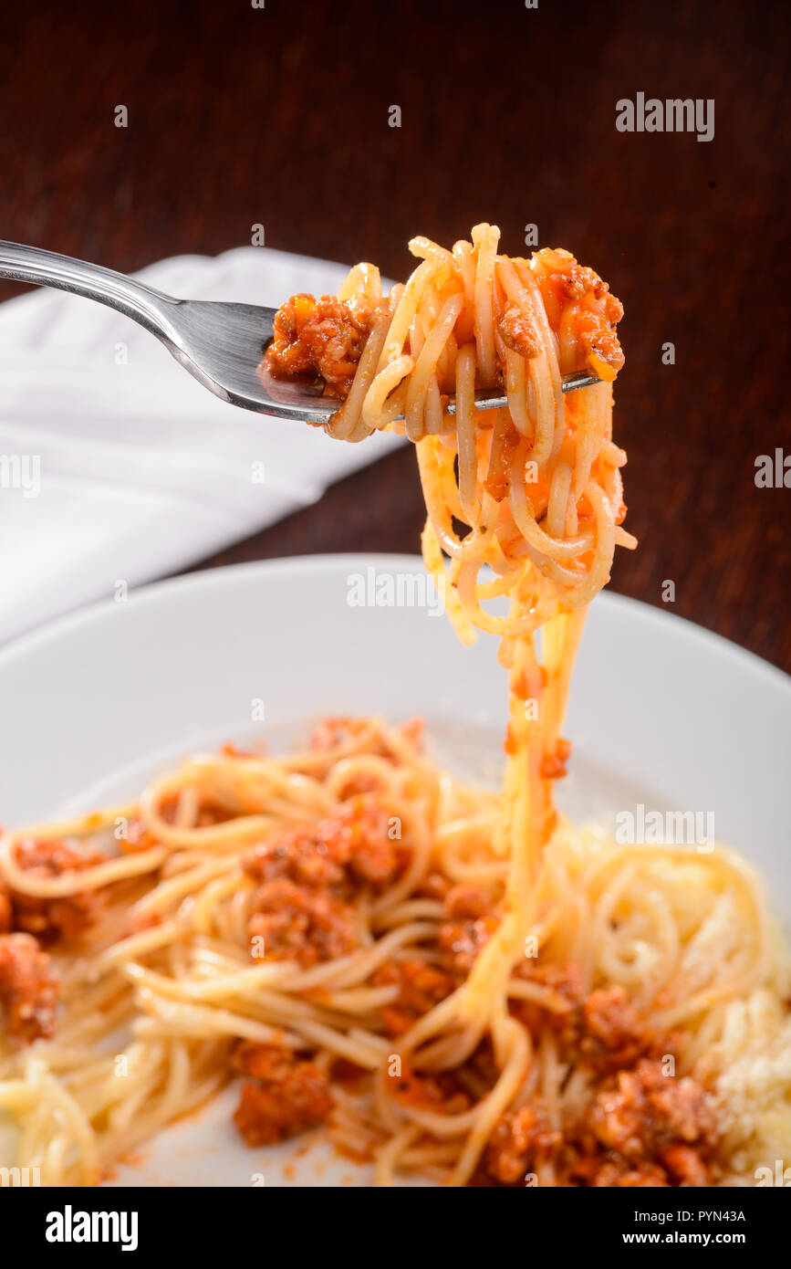 Process of eating of Bolognese Stock Photo - Alamy