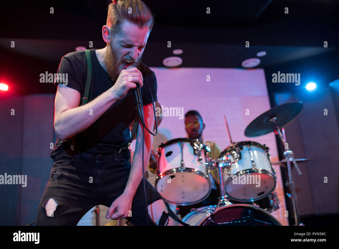 Singer Performing on Stage Stock Photo - Alamy