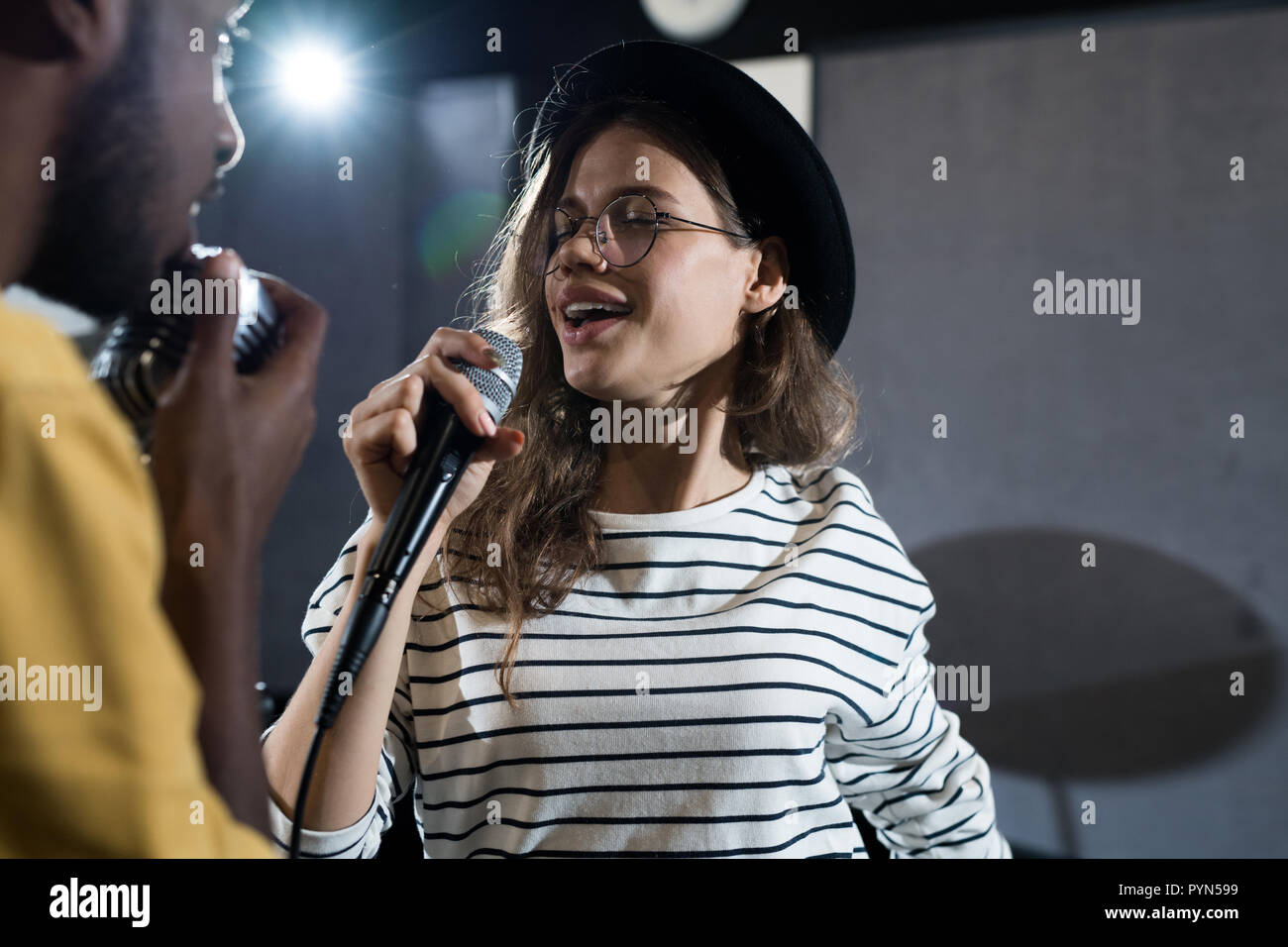 Young Woman Singing Stock Photo - Alamy