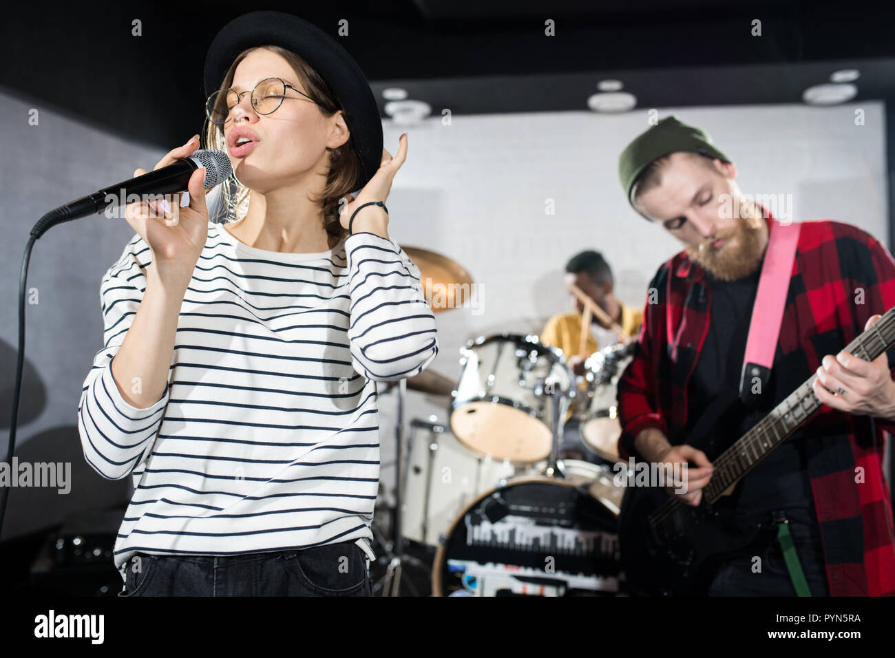 Music Band Performing in Club Stock Photo - Alamy