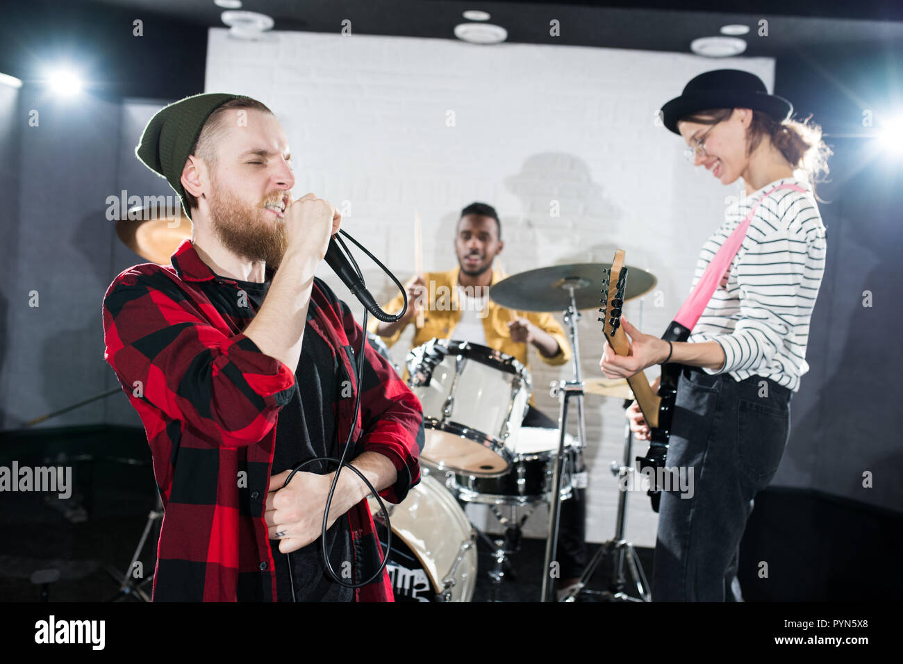 Rock Band Performing on Stage Stock Photo - Alamy