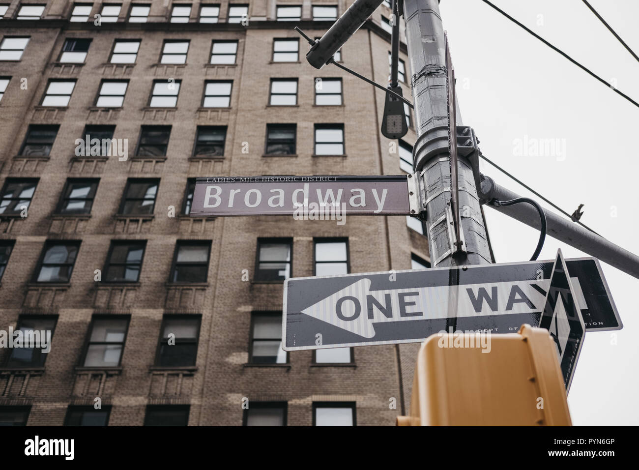 Street name and road signs on a lamp post on Broadway in Manhattan, New ...