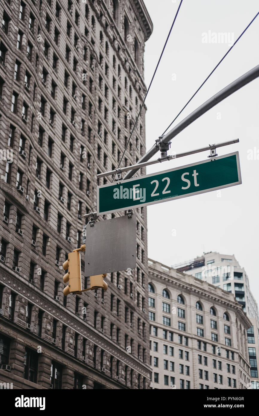Street name and road signs on a lamp post on 22nd East Street in ...