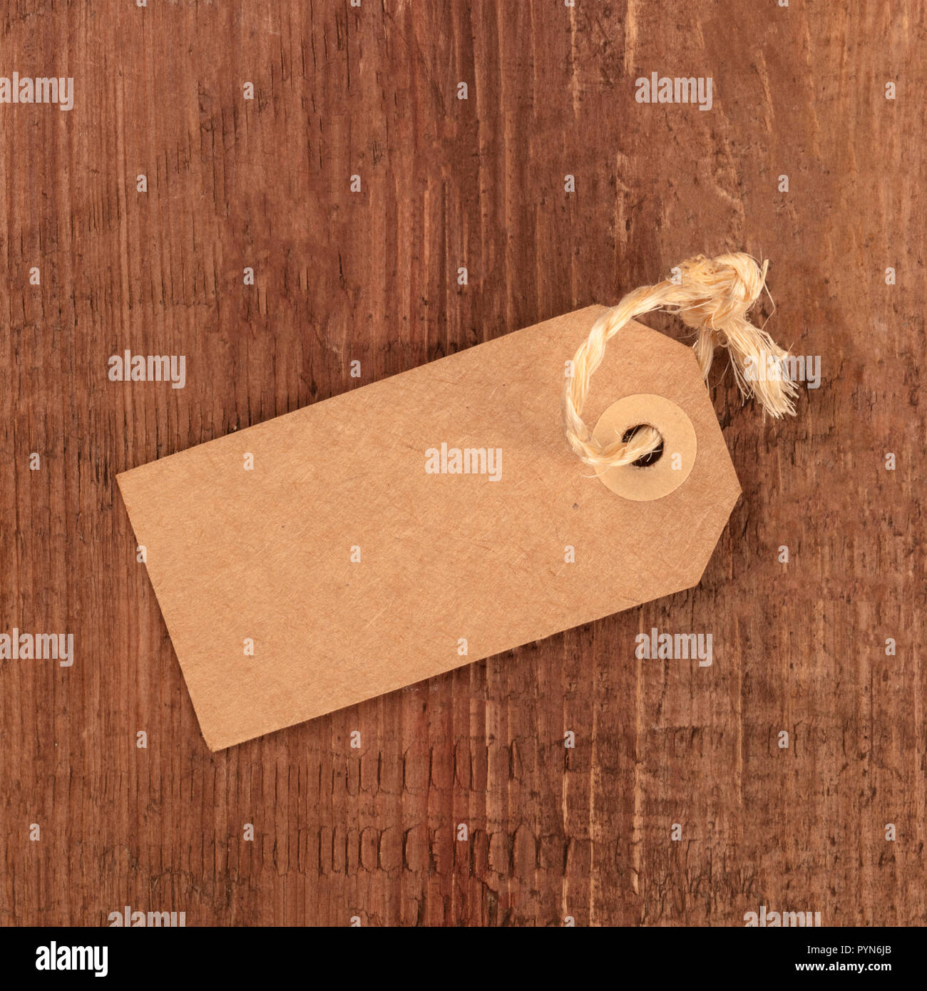 A photo of a brown kraft paper label or price tag, shot from the top on ...