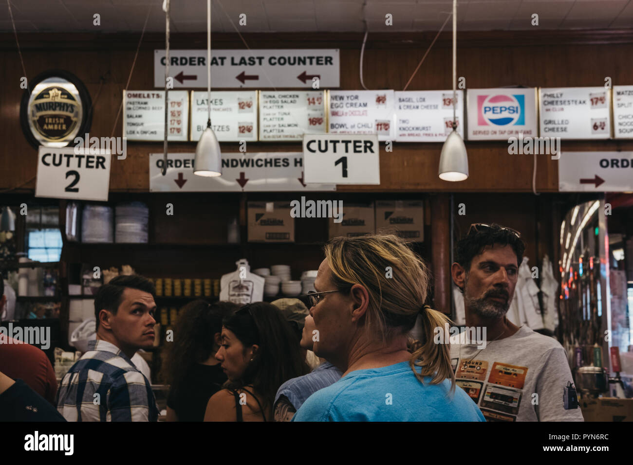 New York, USA - May 29, 2018: Customers waiting for food at the counter ...