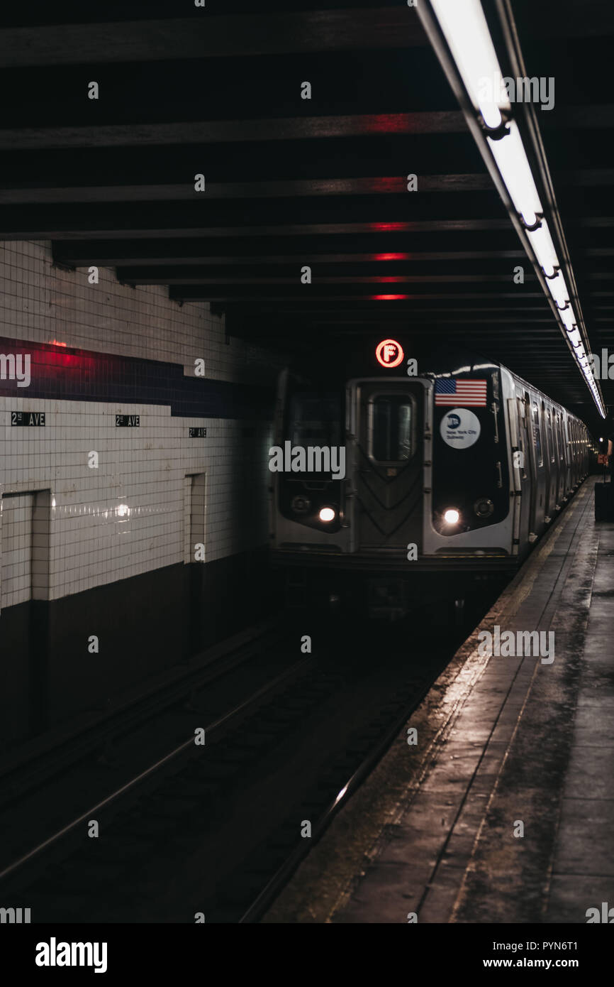 New York, USA - May 29, 2018: F Line Train arriving at a station ...