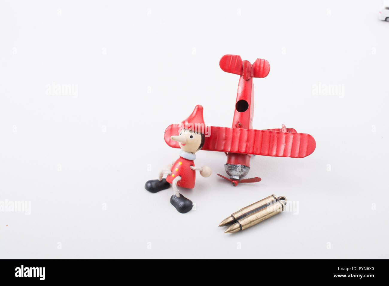 Airplane, Bullet and wooden pinocchio with his long nose Stock Photo ...