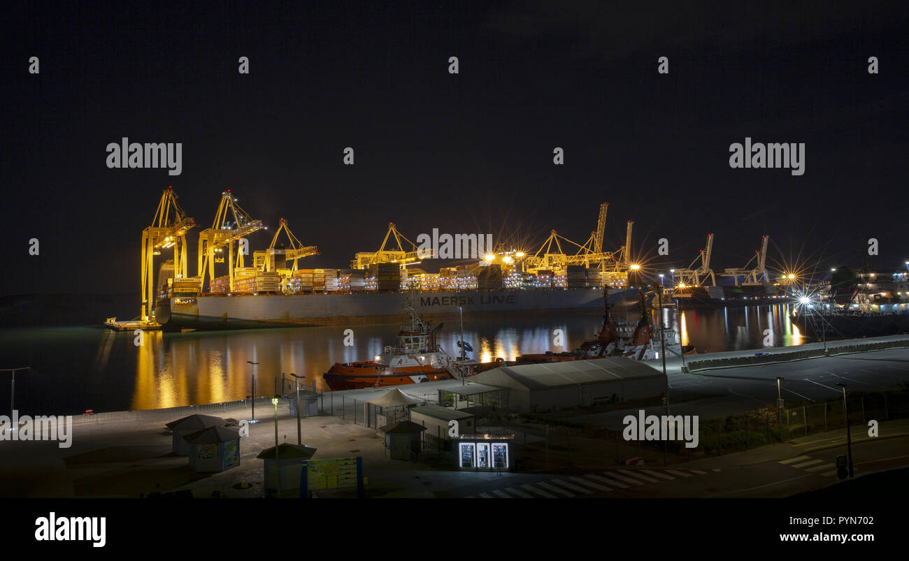 Cargo ship at the port in port Koper at night Stock Photo - Alamy