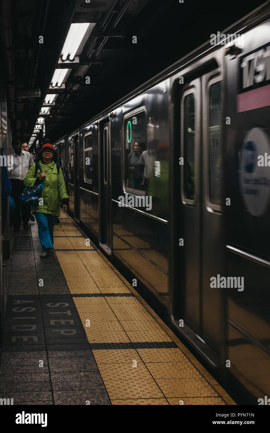 New York, USA - June 1, 2018: People walking on a subway station ...