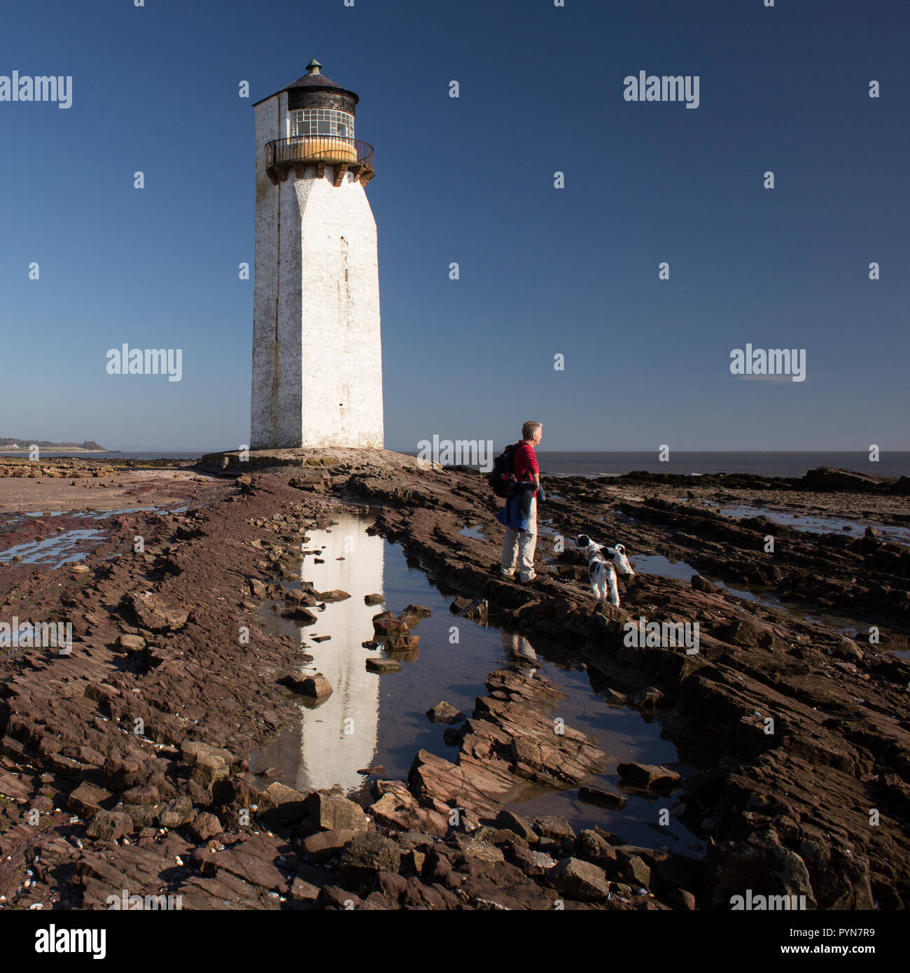 Man standing lighthouse sea hi-res stock photography and images - Alamy