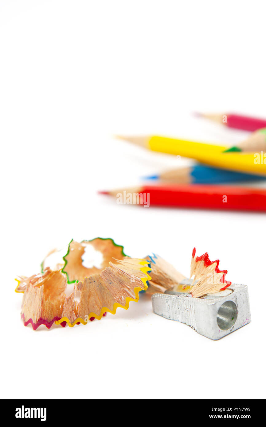 Colorful pencil sharpener with shavings on white Stock Photo - Alamy