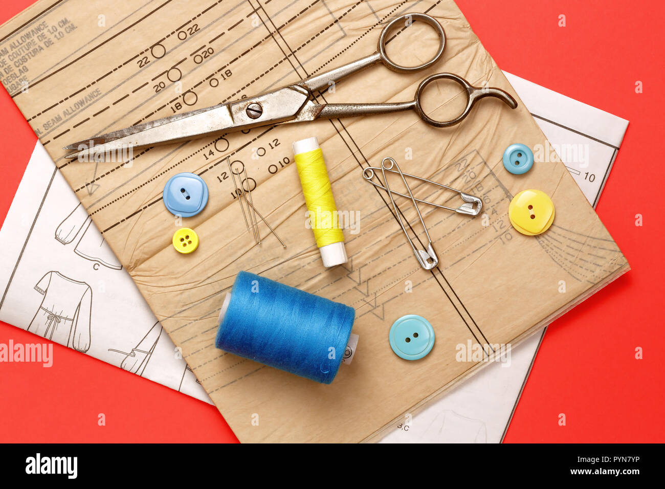 Scissors with material pattern and string for working with fabric Stock ...