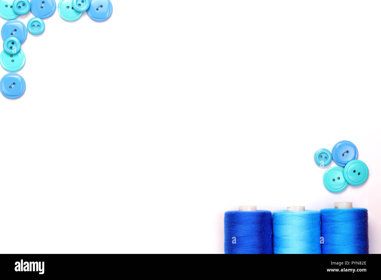 Shades of blue clothing buttons with blue string Stock Photo - Alamy