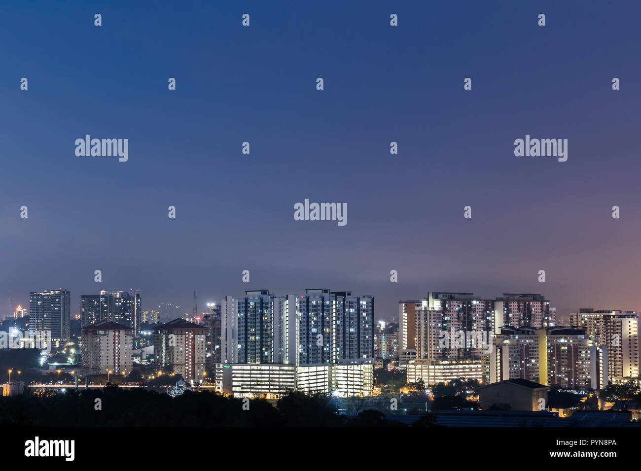Urban condominiums and apartment during blue hour Stock Photo - Alamy