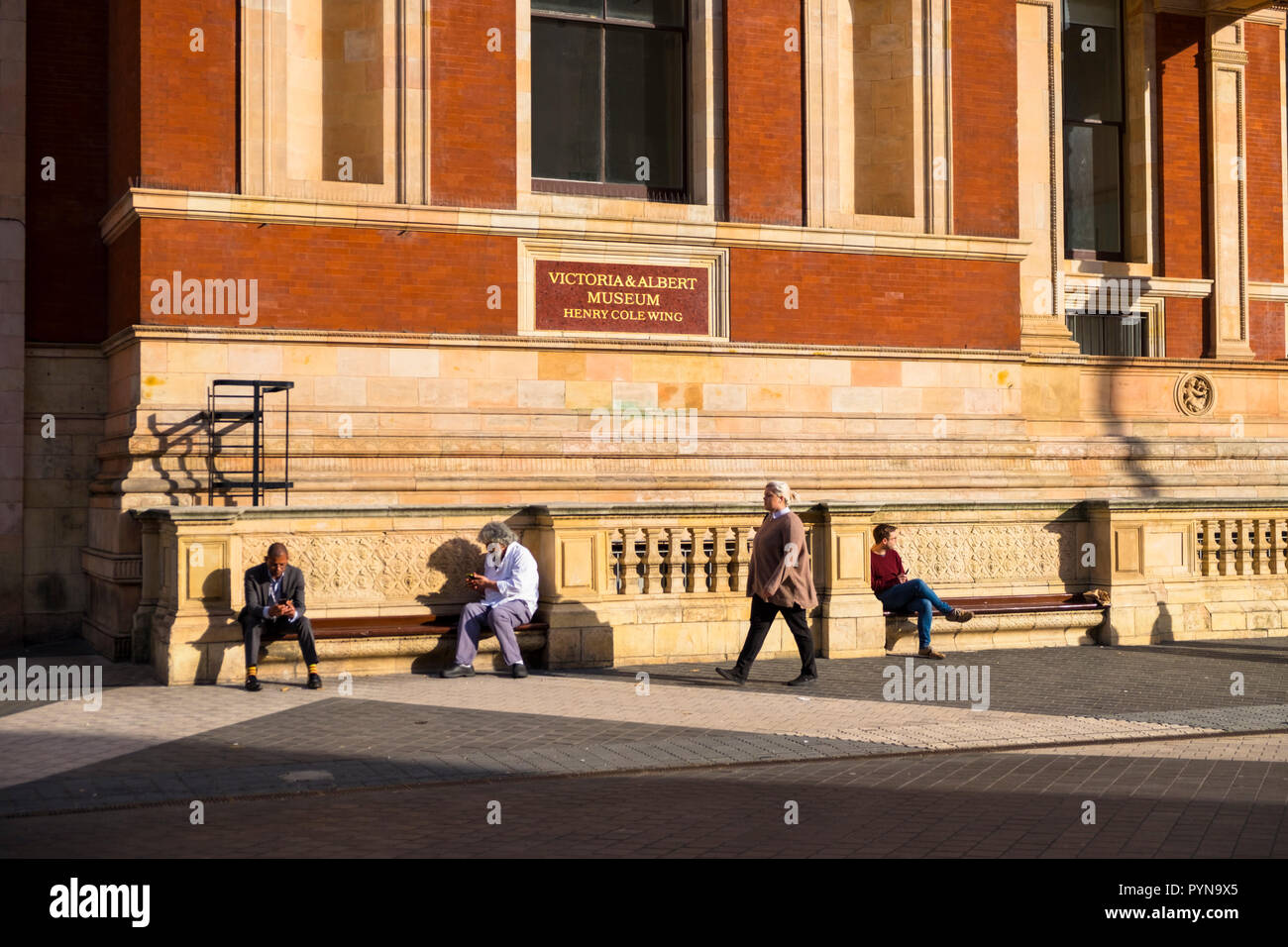 Victoria and albert museum, henry cole wing, people sitting down on a ...