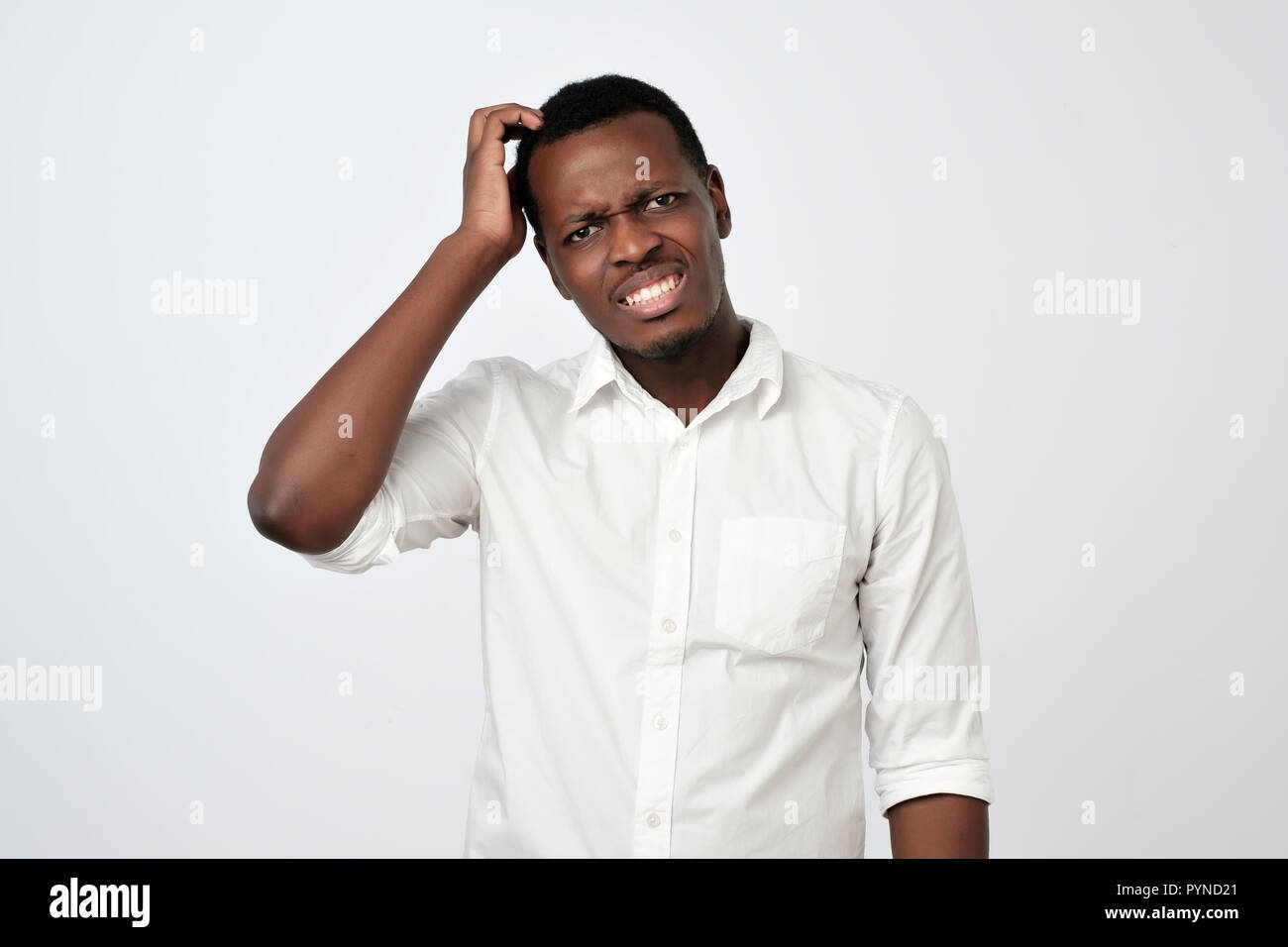 African boy scratching the head hi-res stock photography and images - Alamy