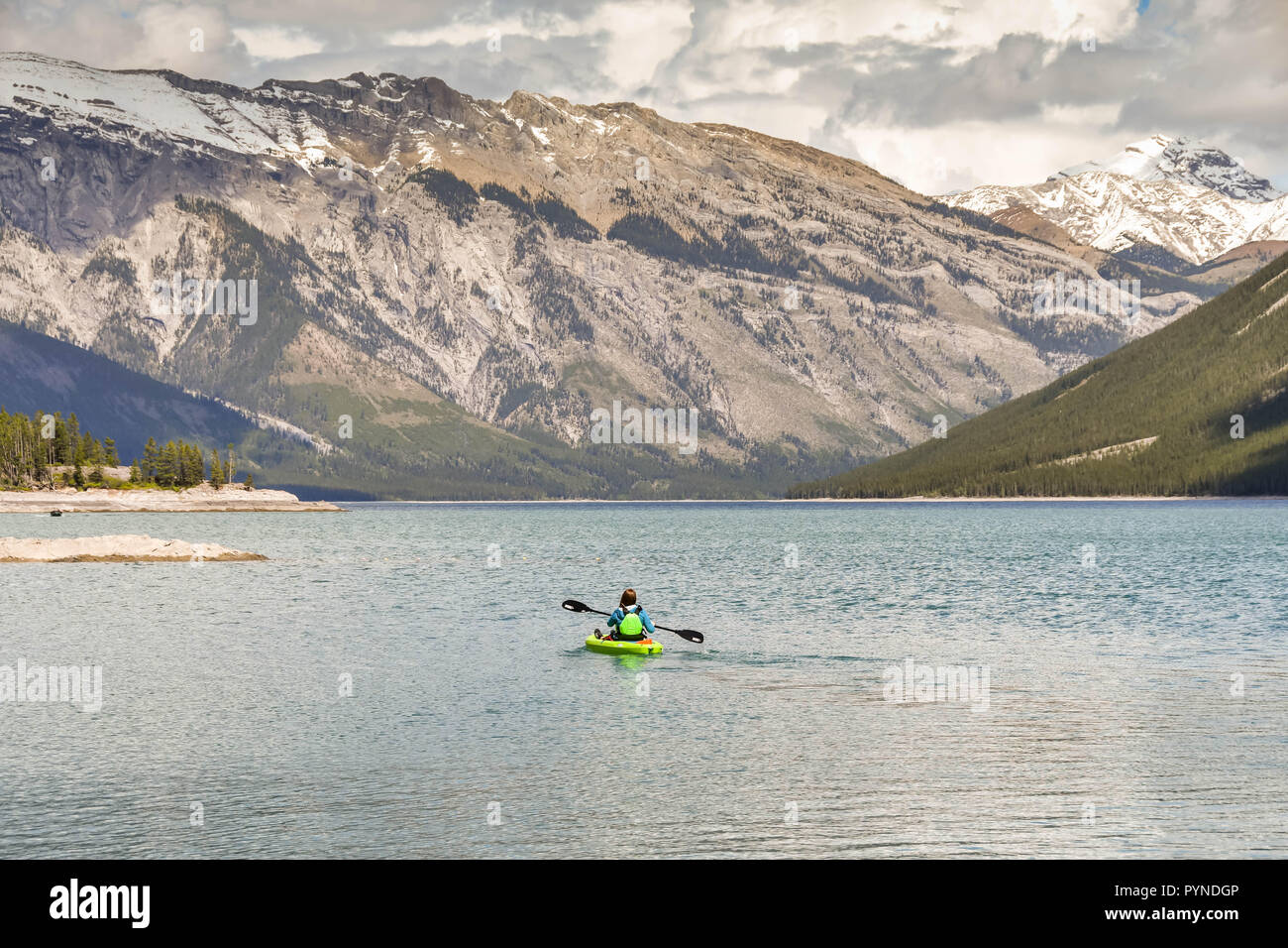 BANFF, AB, CANADA - JUNE 2018: Scenic view of a visitor paddling a ...